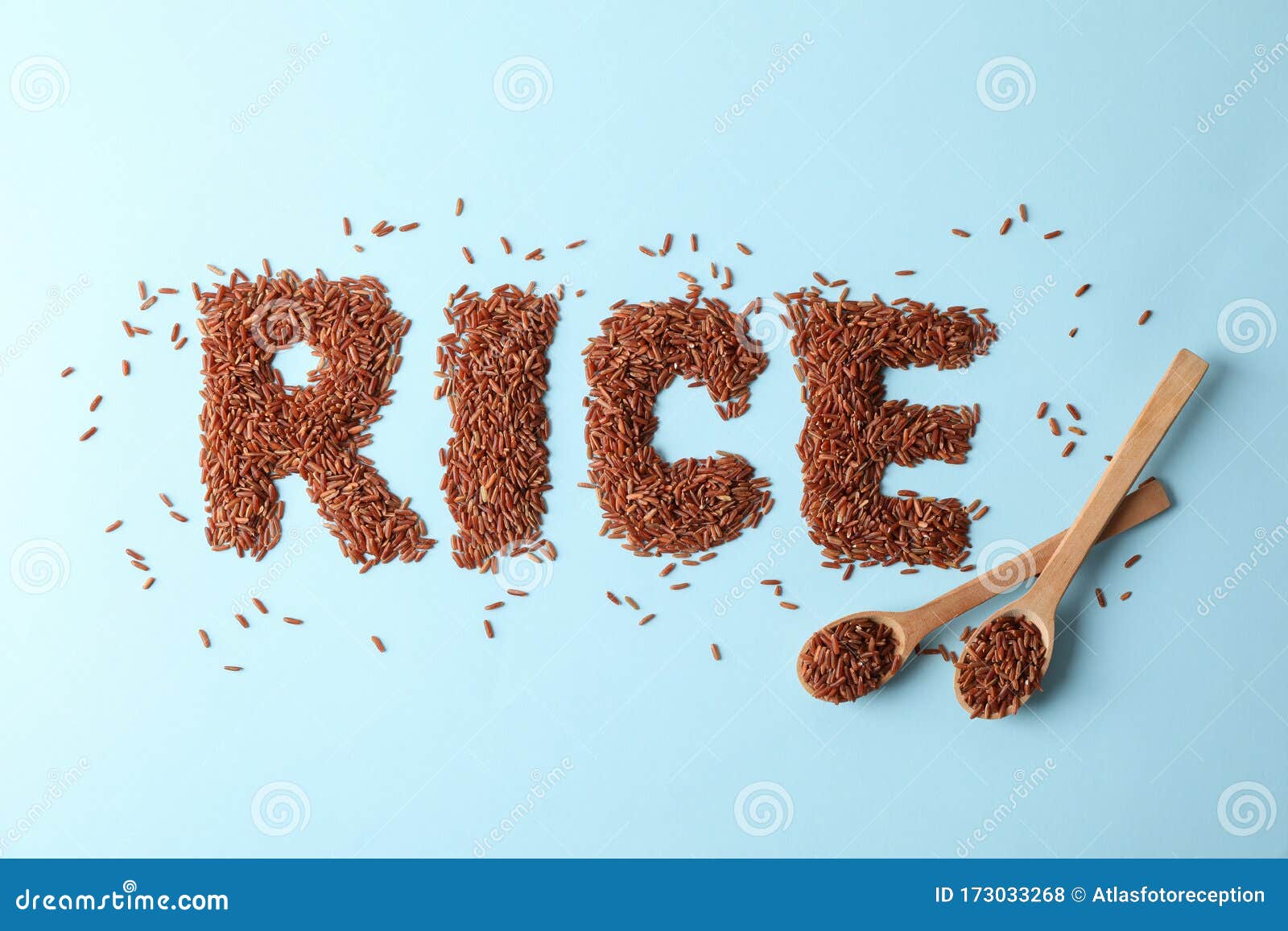 Word Rice Made of Rice and Spoons on Blue Background Stock Photo ...