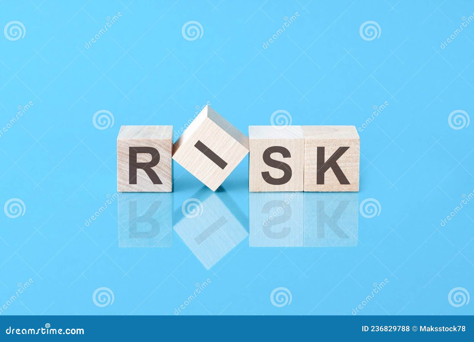 Word Risk from Wooden Blocks with Letters, Front View on Blue ...