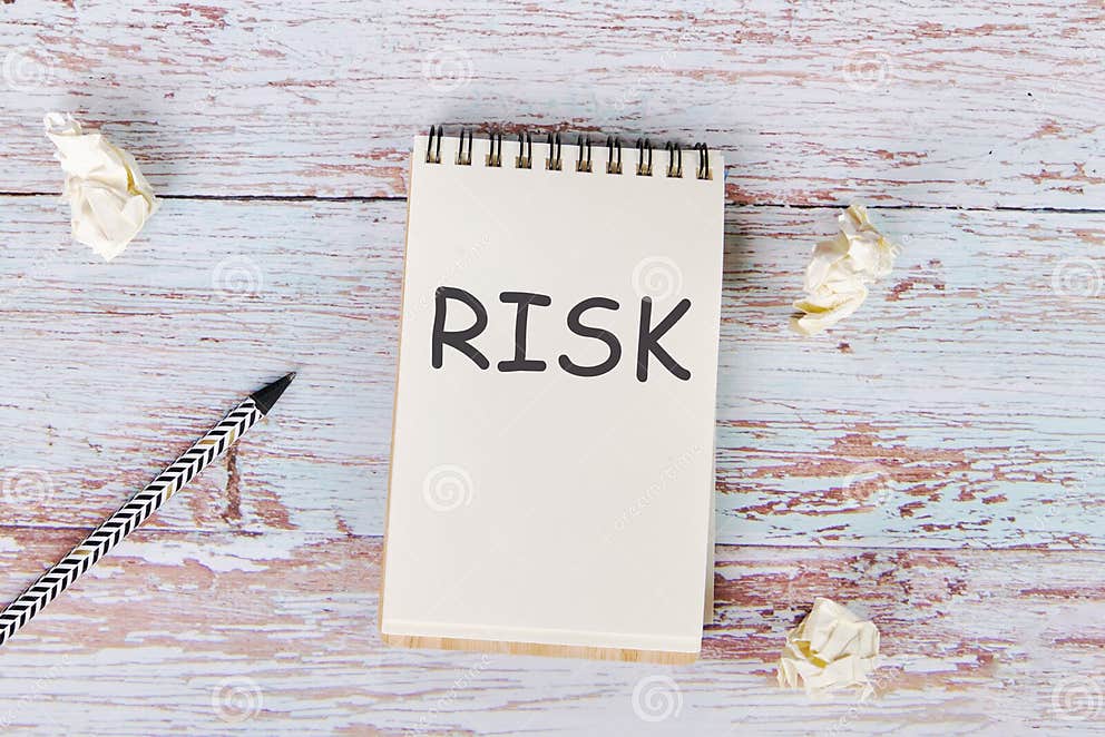 The Word Risk is Written on a Notebook. the Concept of an Unpredictable ...