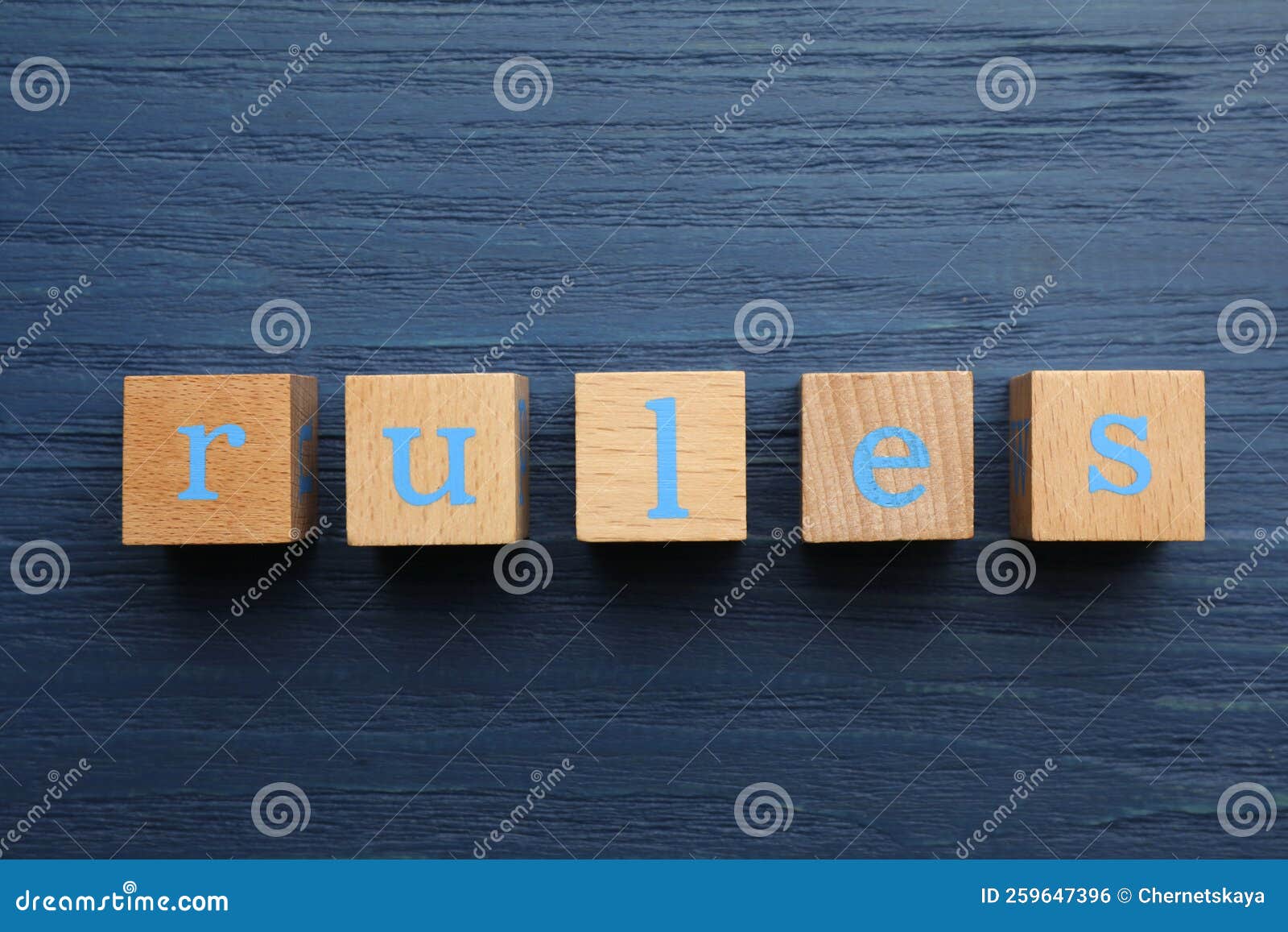 Word Rules Made of Cubes with Letters on Blue Wooden Table, Top View ...