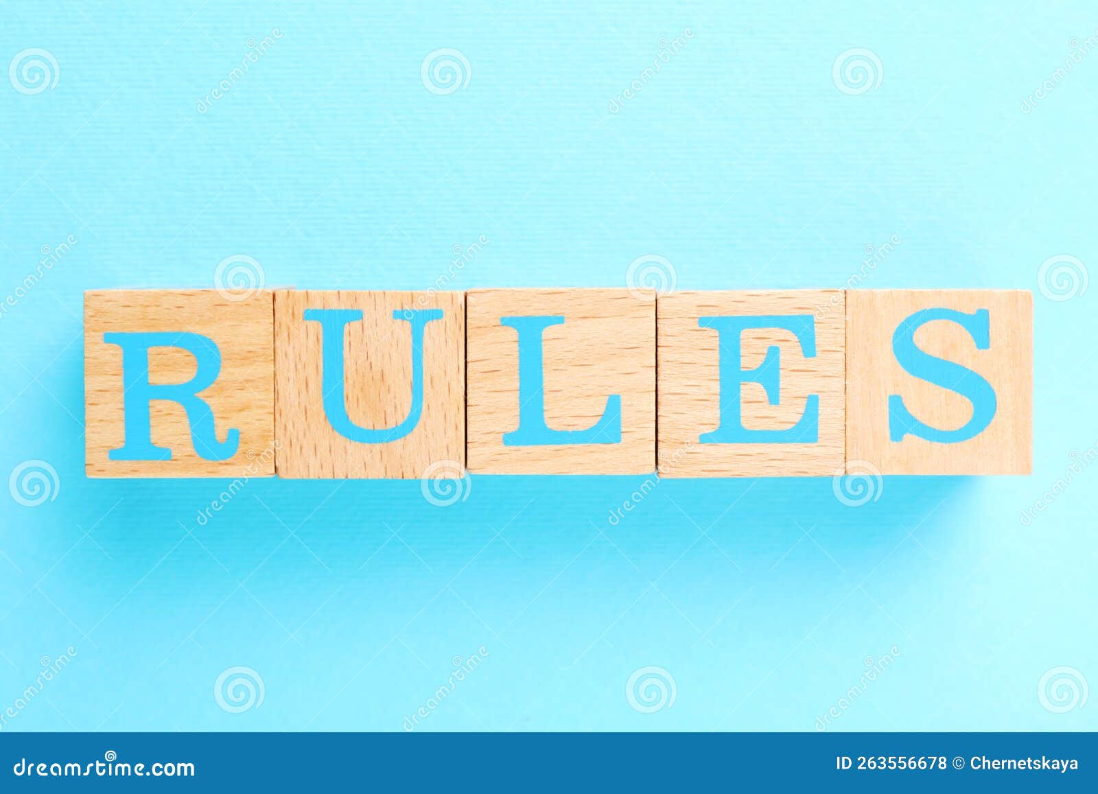 Word Rules Made of Wooden Cubes with Letters on Light Blue Background ...