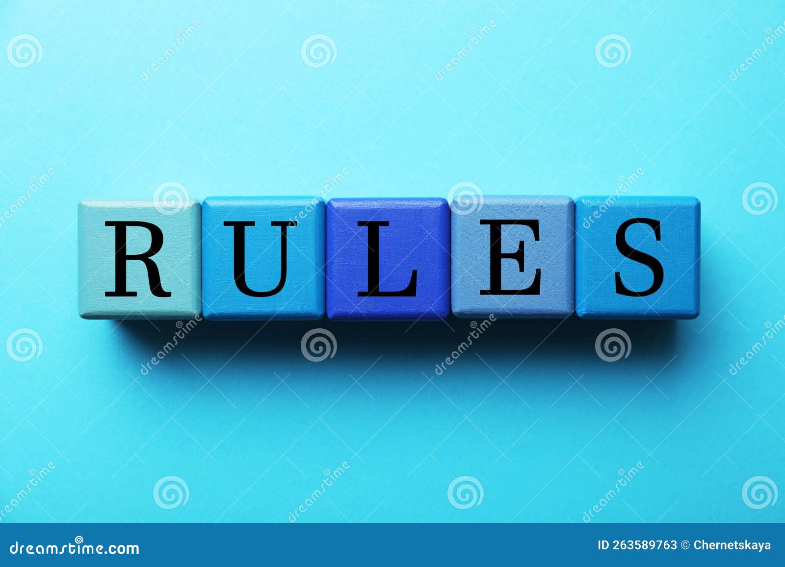 Word Rules Made of Wooden Cubes with Letters on Light Blue Background ...