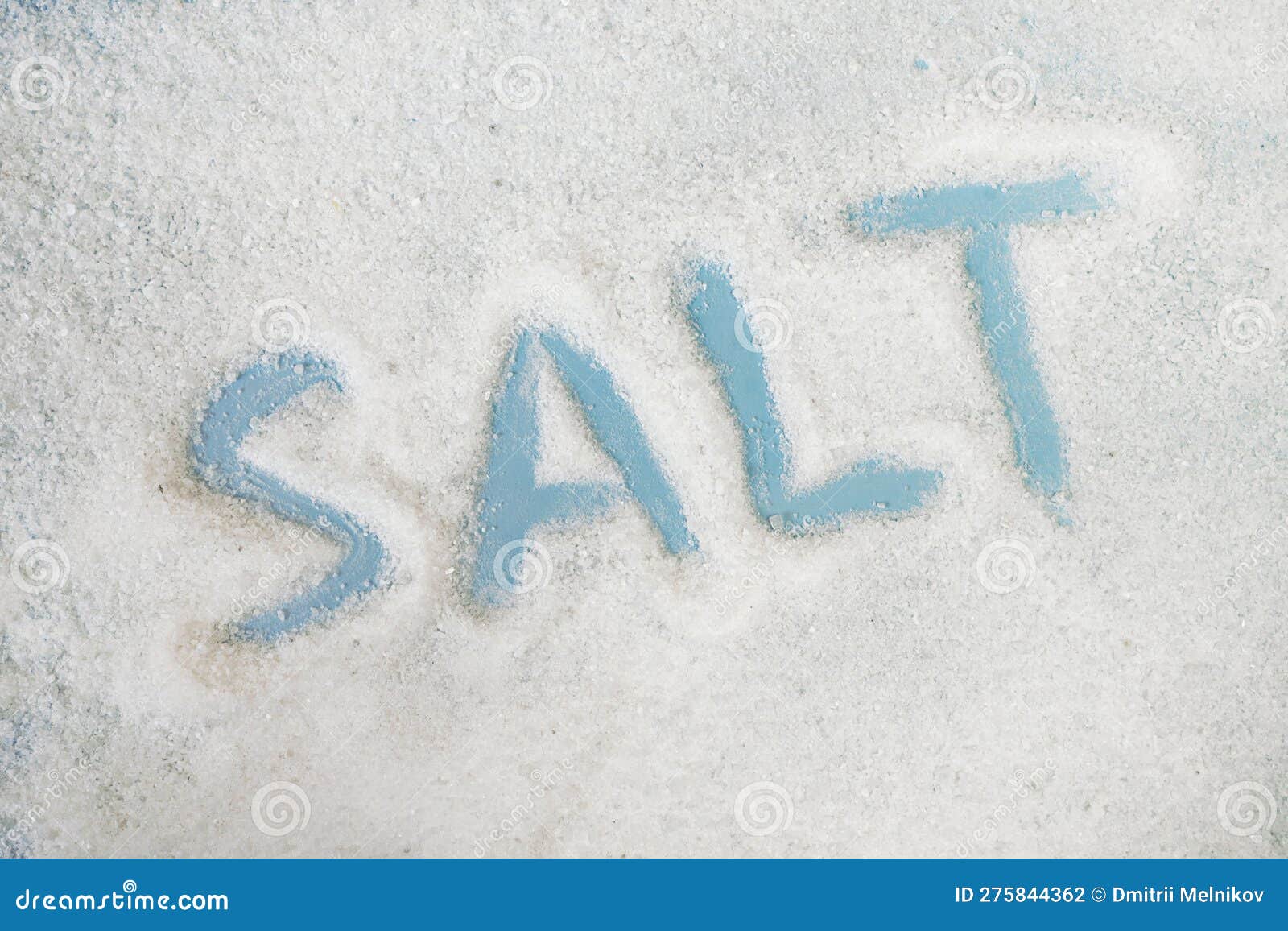The Word Salt is Written with Salt on a Blue Table. Salt Grain Top View ...