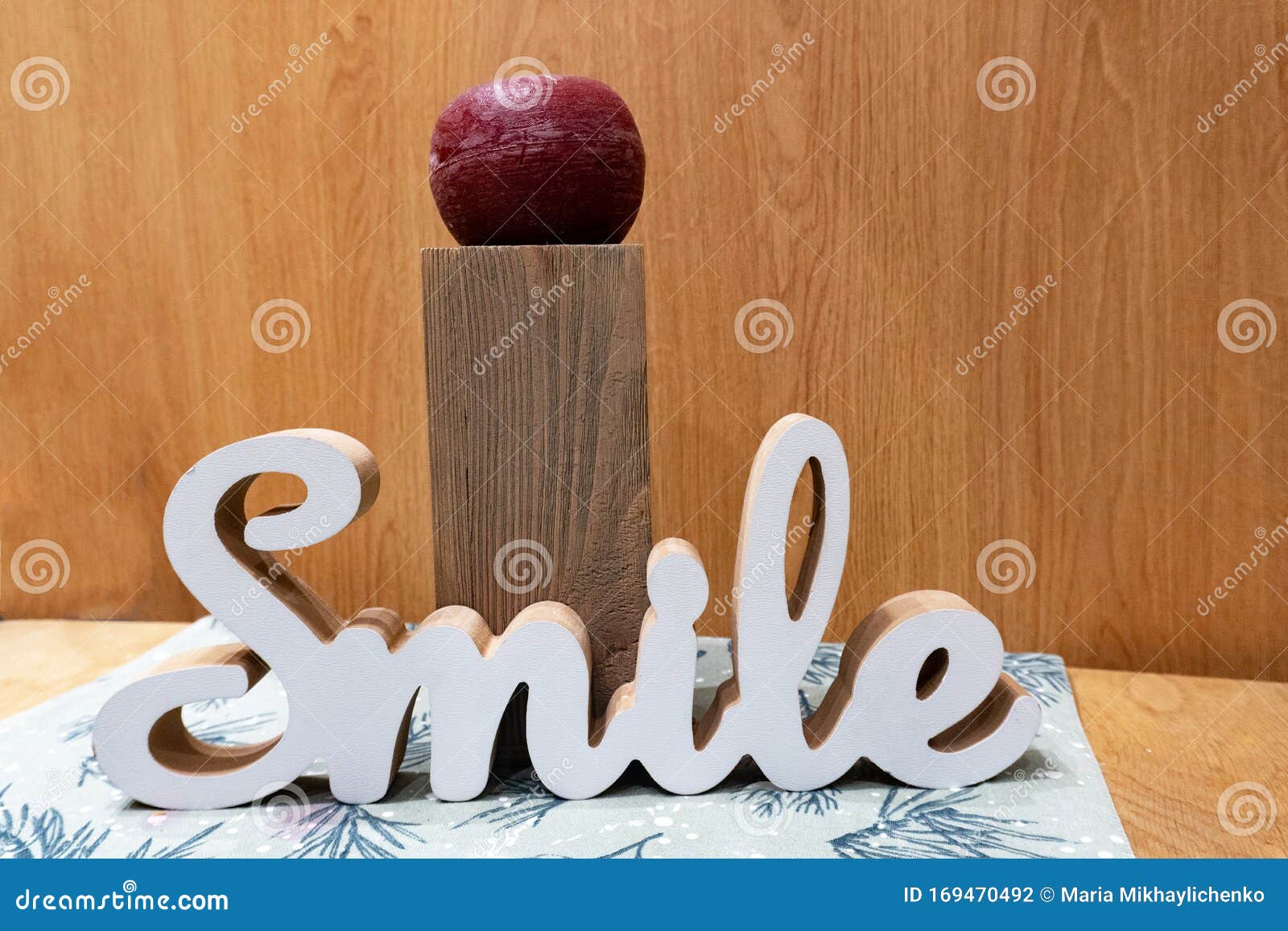 Word Smile from Wooden Letters on Table in Interior. Stock Photo ...