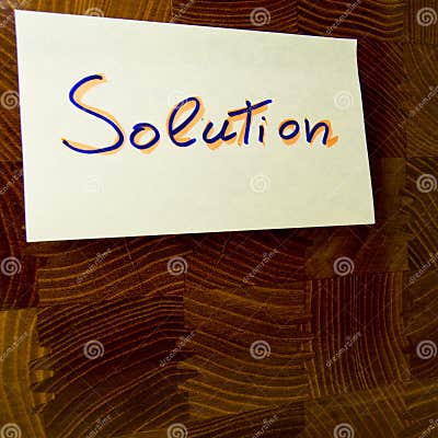 Word Solution Written on a Yellow Postit Attached on a Wood Panel - for ...