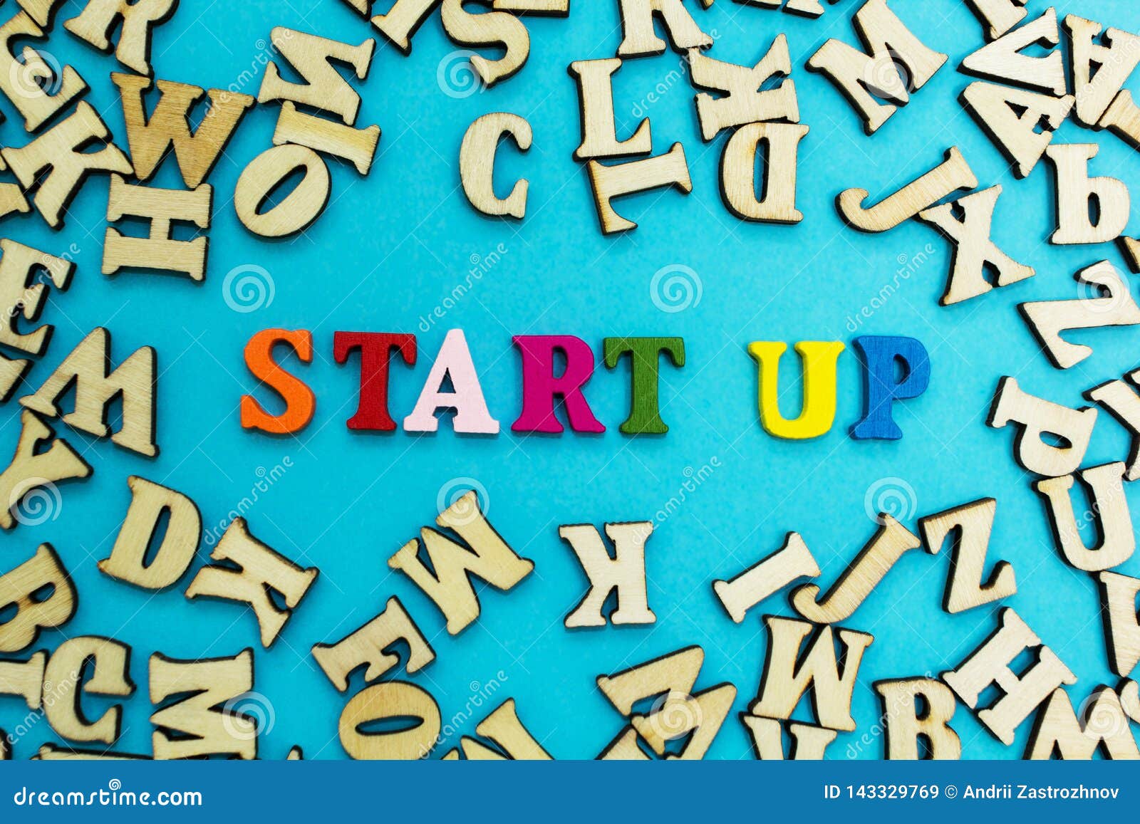 The Word `start Up` is Laid Out from Multicolored Letters on a Blue ...
