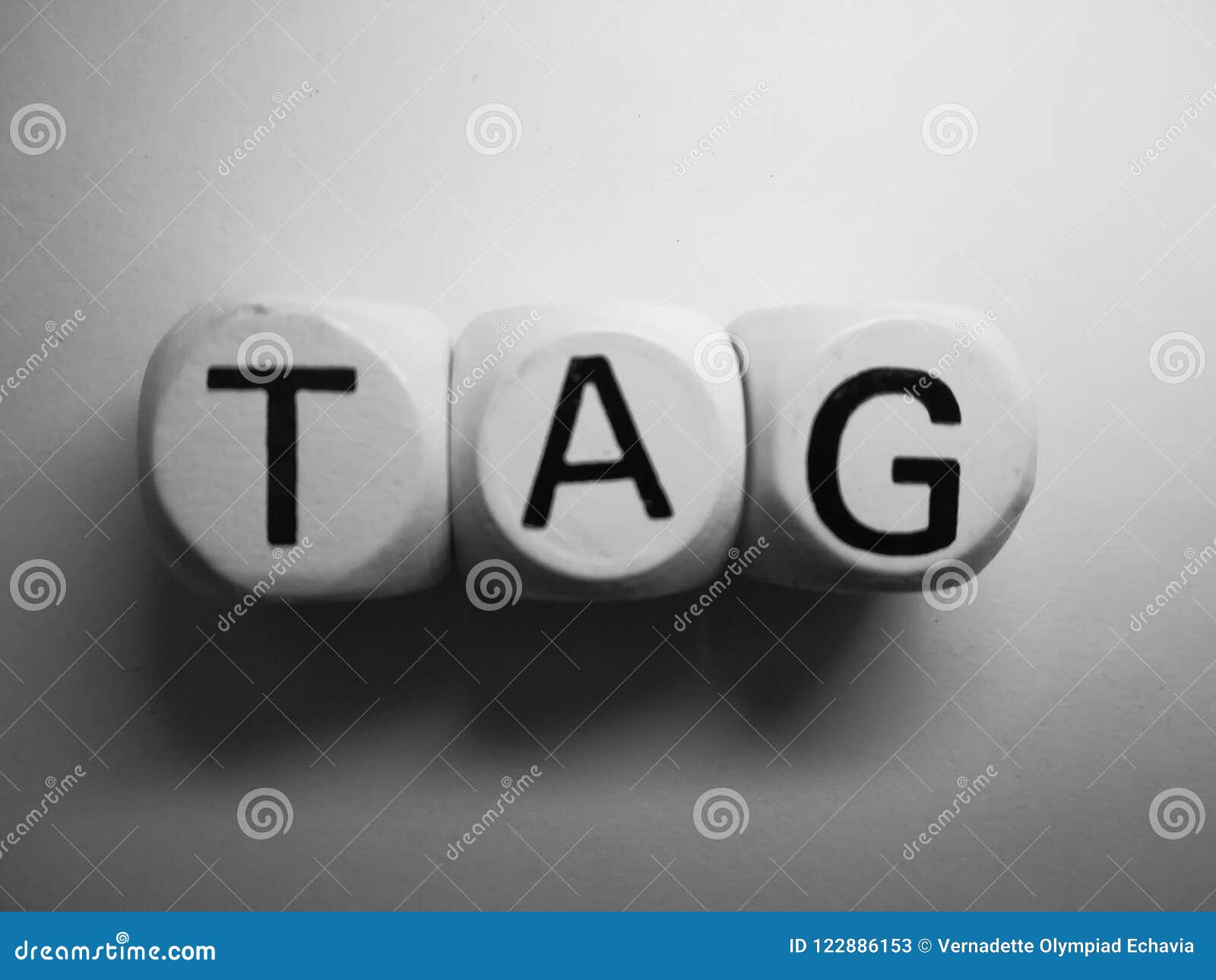 Word tag on wooden dice stock image. Image of spelling - 122886153