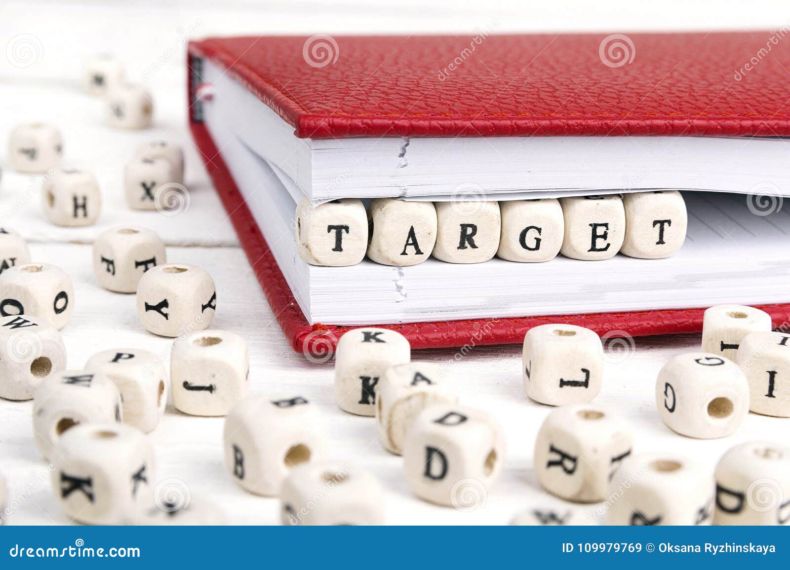 Word Target Written in Wooden Blocks in Notebook on White Wooden Stock ...