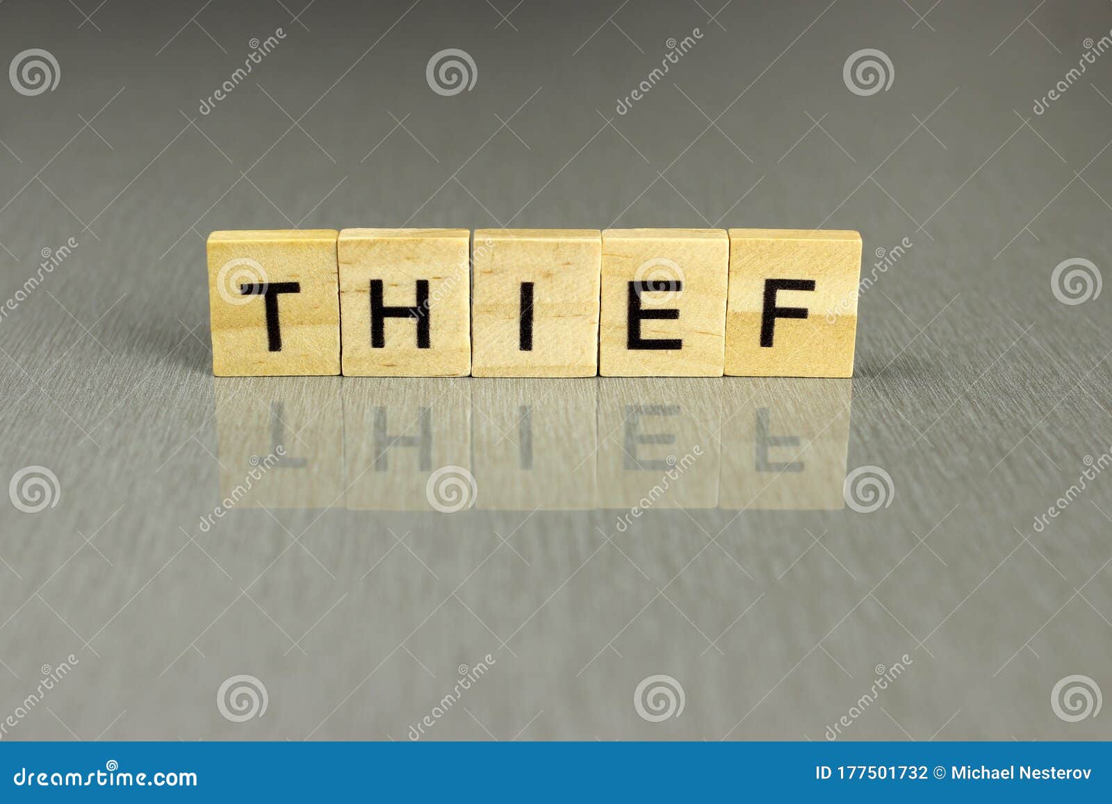 Word Thief Made of Square Wooden Letters on a Gray Background Stock ...