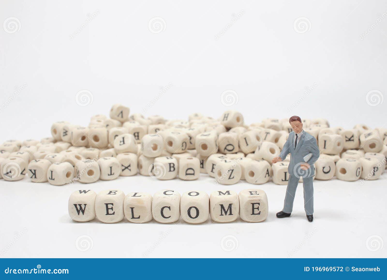 A Word Welcome on Wooden Cube Block with Figure Stock Photo - Image of ...