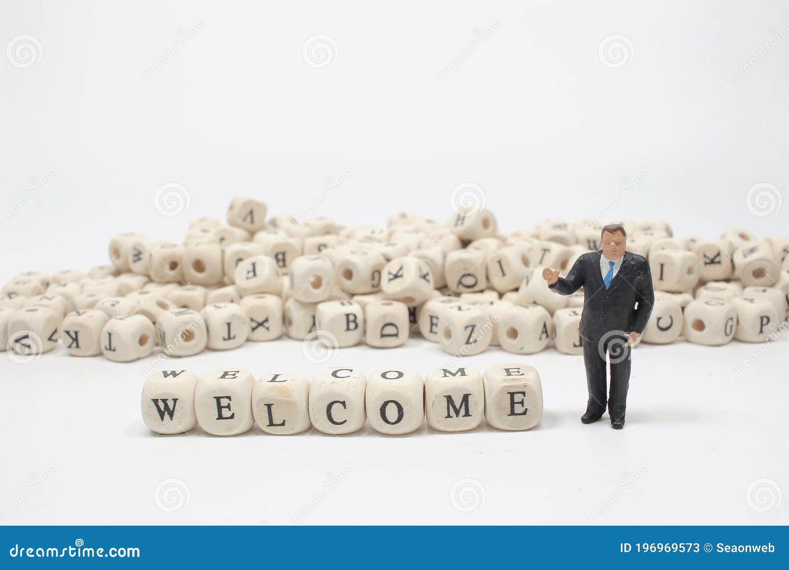 A Word Welcome on Wooden Cube Block with Figure Stock Image - Image of ...