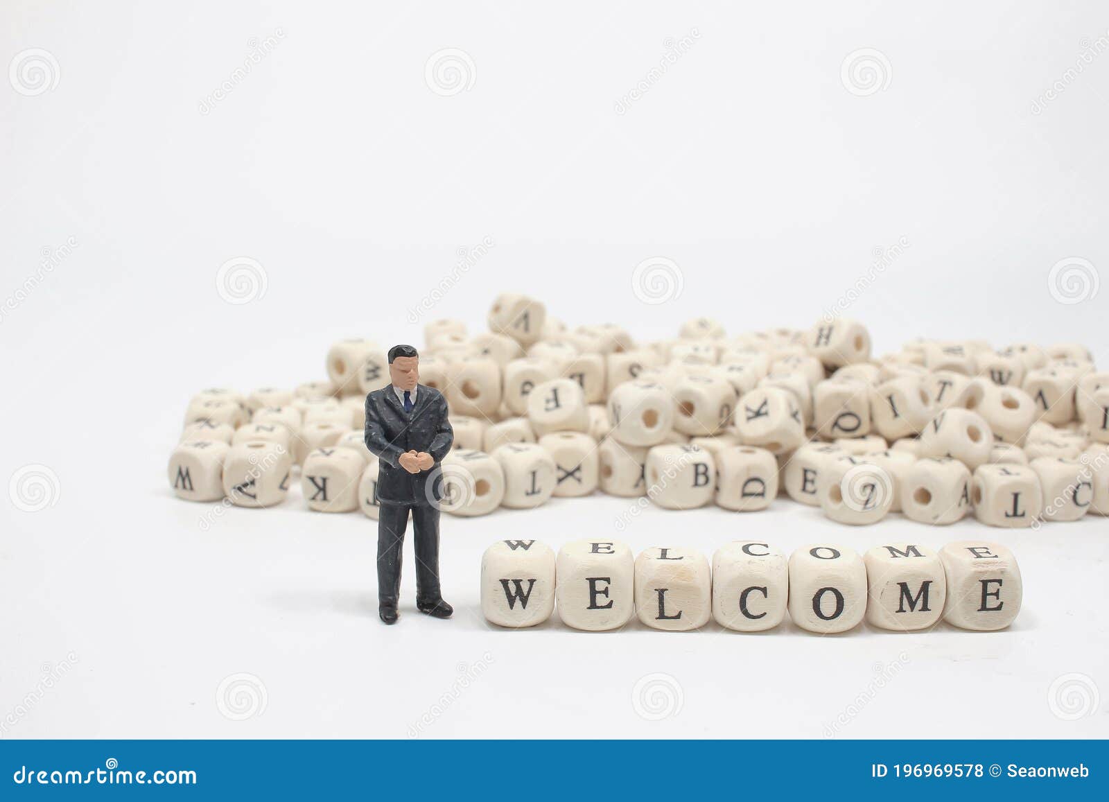 A Word Welcome on Wooden Cube Block with Figure Stock Photo - Image of ...