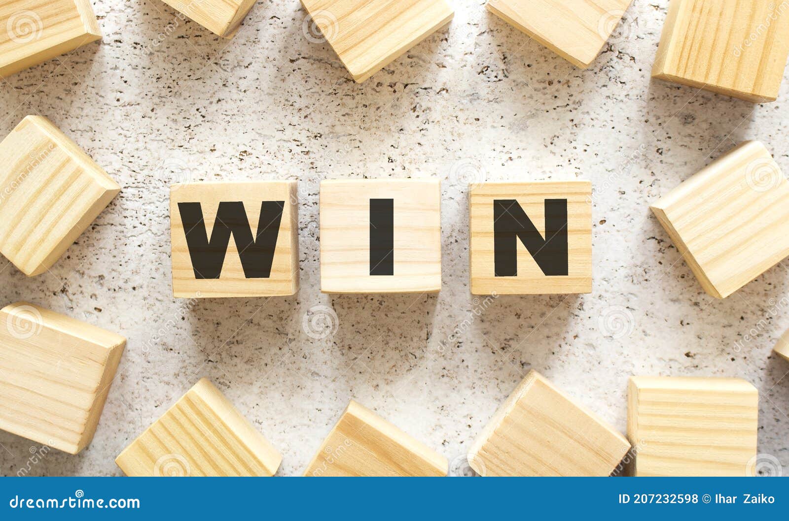 The Word WIN Consists of Wooden Cubes with Letters, Top View on a Light ...