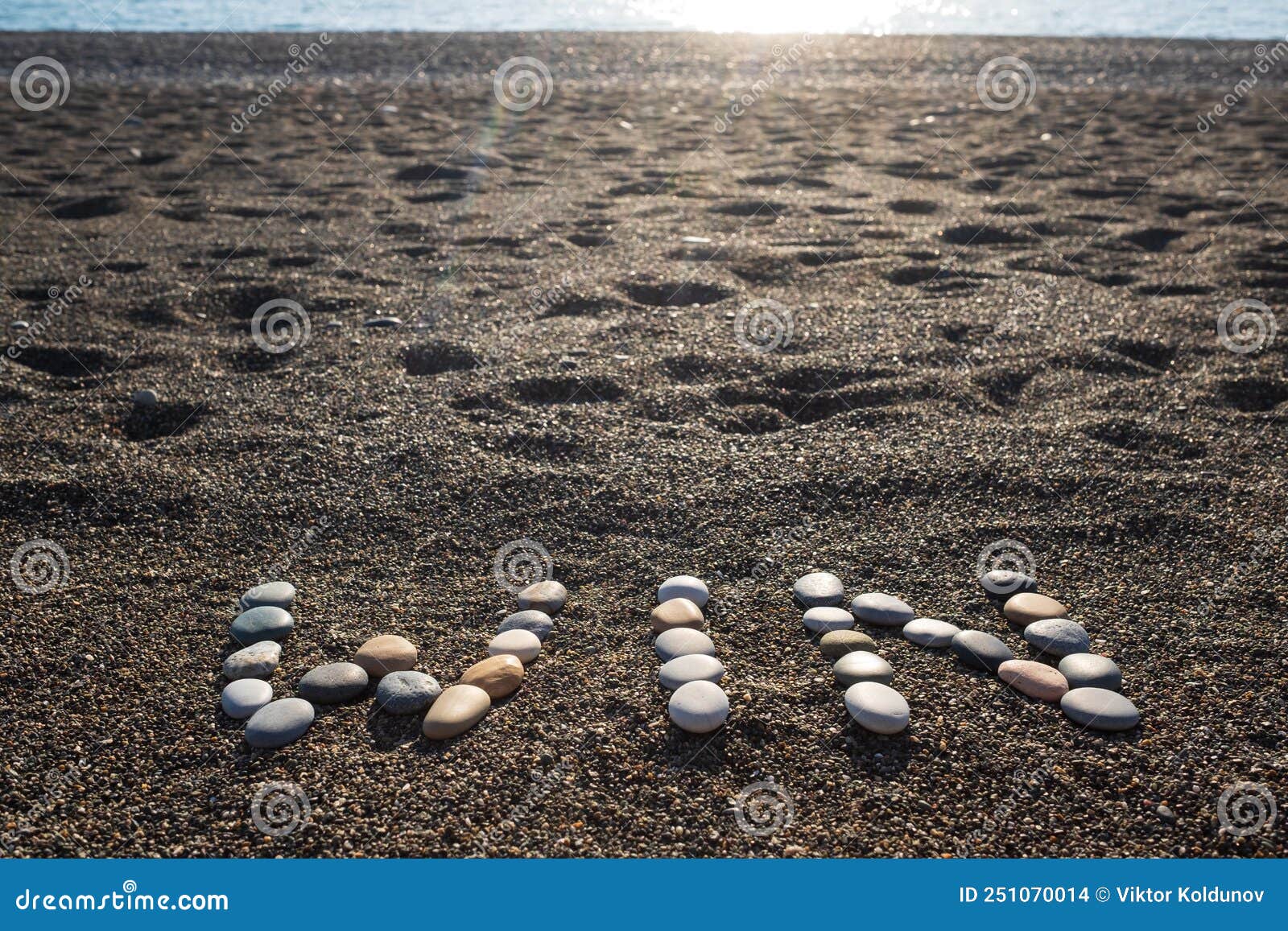 Word Win Made from Stones on Sandy Beach. Stock Photo - Image of ...