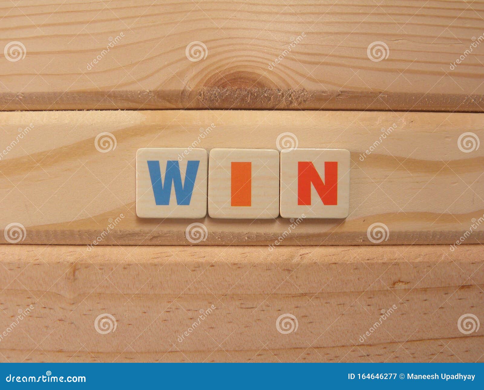 Word Win on wood stock image. Image of colors, characters - 164646277