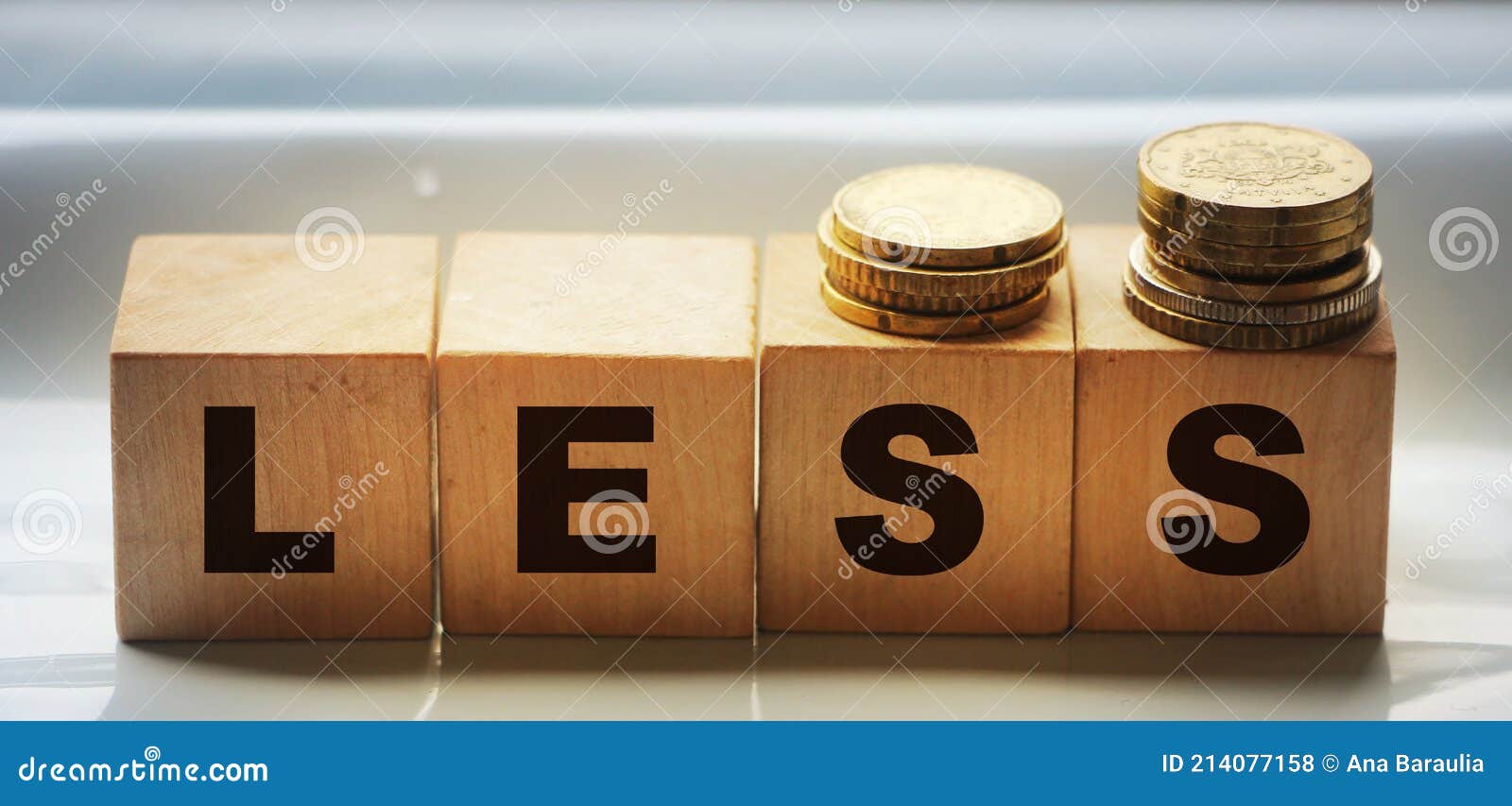 Less Word on Wooden Alphabet Blocks and Stack of Coins. less Spend ...