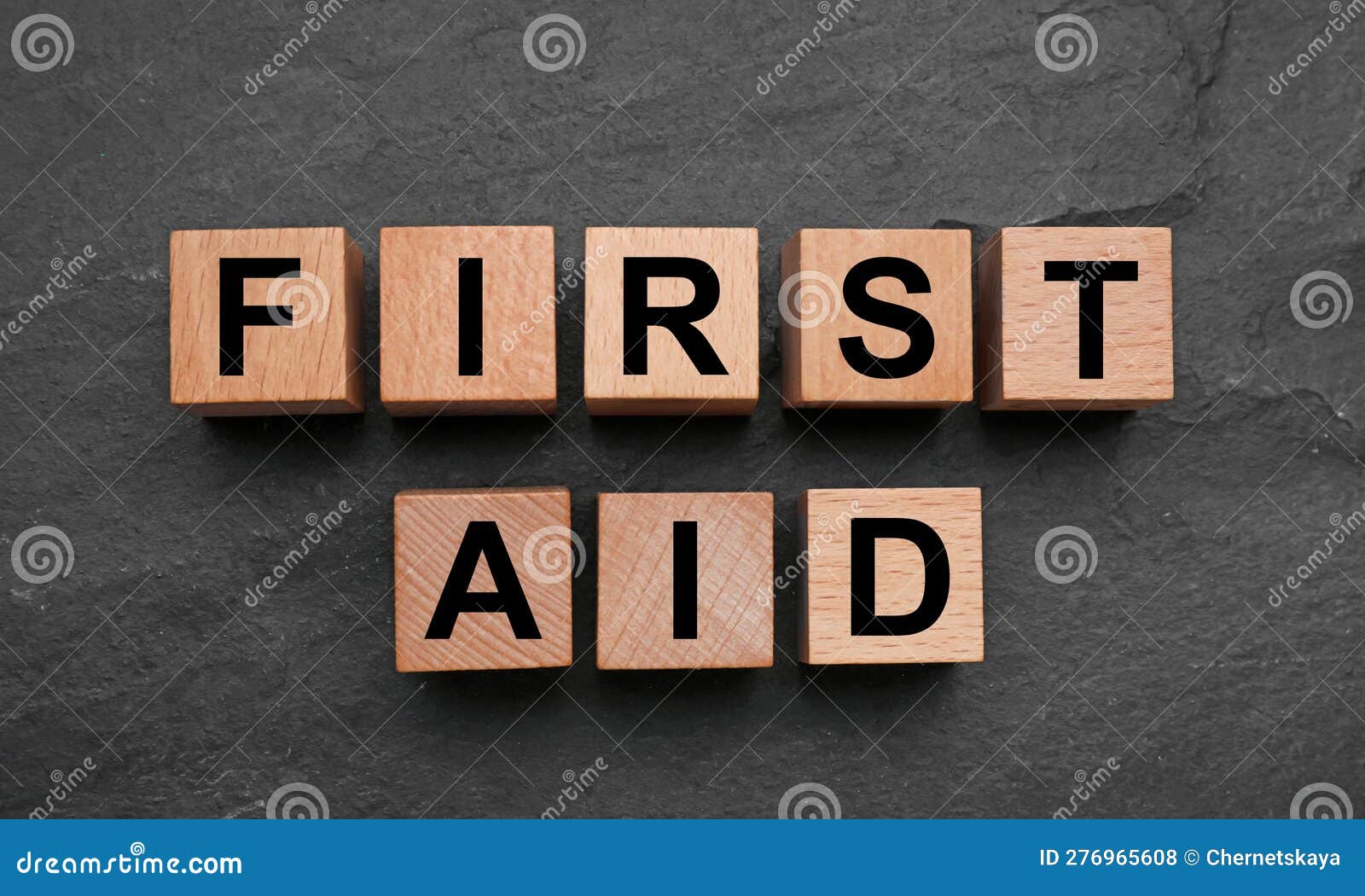 Words First Aid Made of Wooden Cubes on Black Table, Flat Lay Stock ...