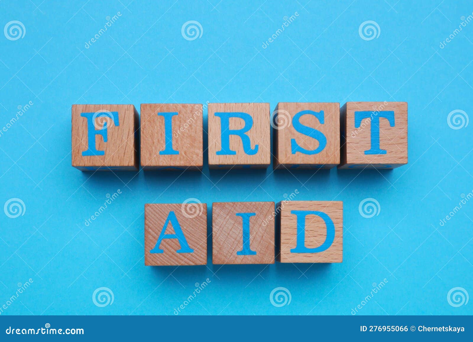 Words First Aid Made of Wooden Cubes on Light Blue Background, Flat Lay ...
