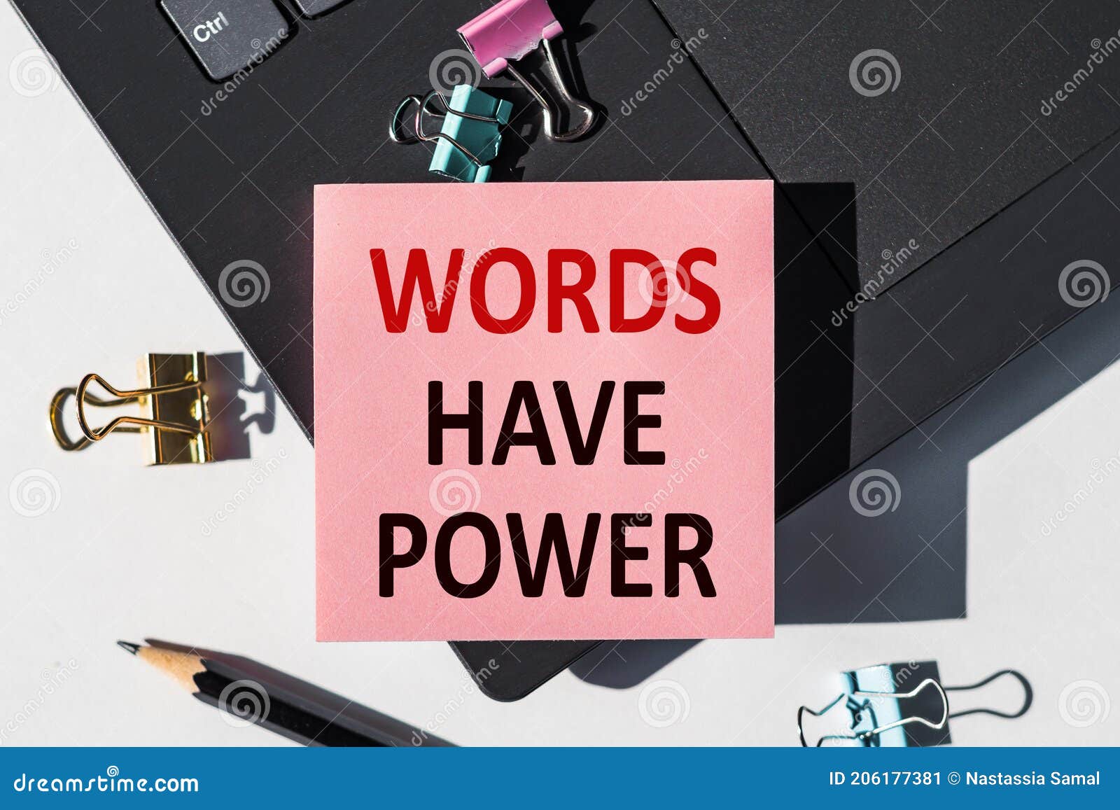 WORDS HAVE POWER Note is Written on a Paper Sticker on a Laptop ...