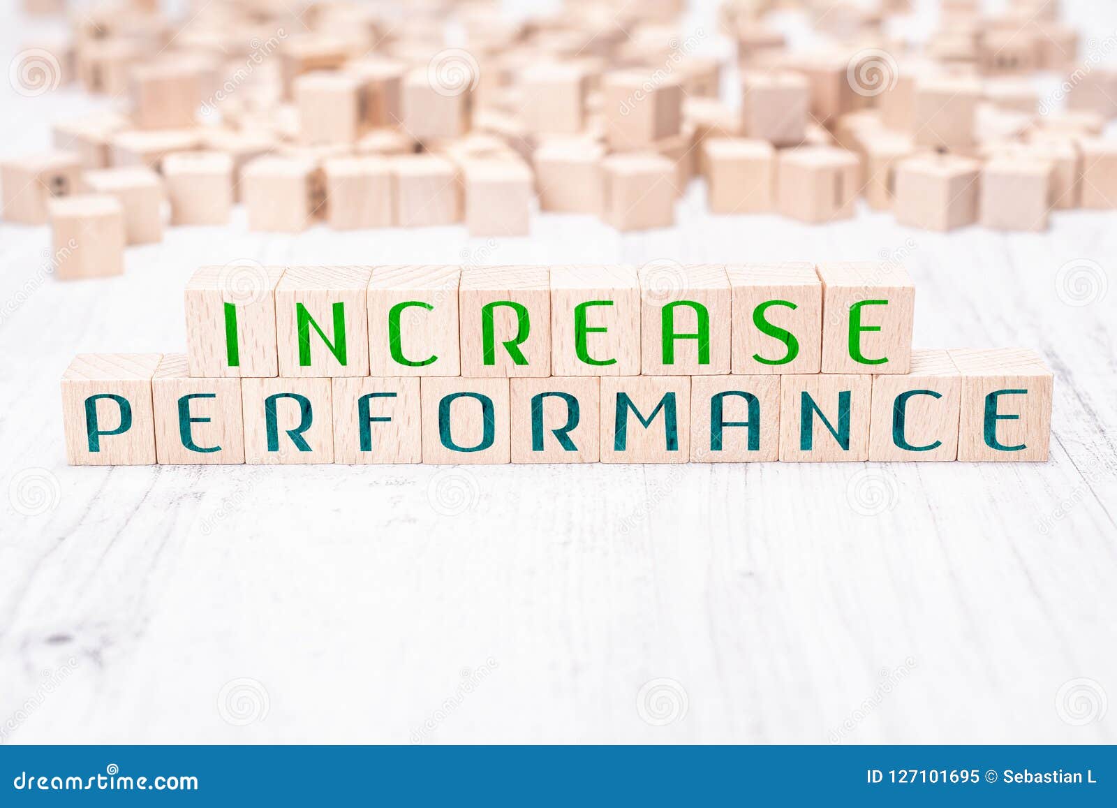 The Words Increase Performance Formed by Wooden Blocks on a White Table ...