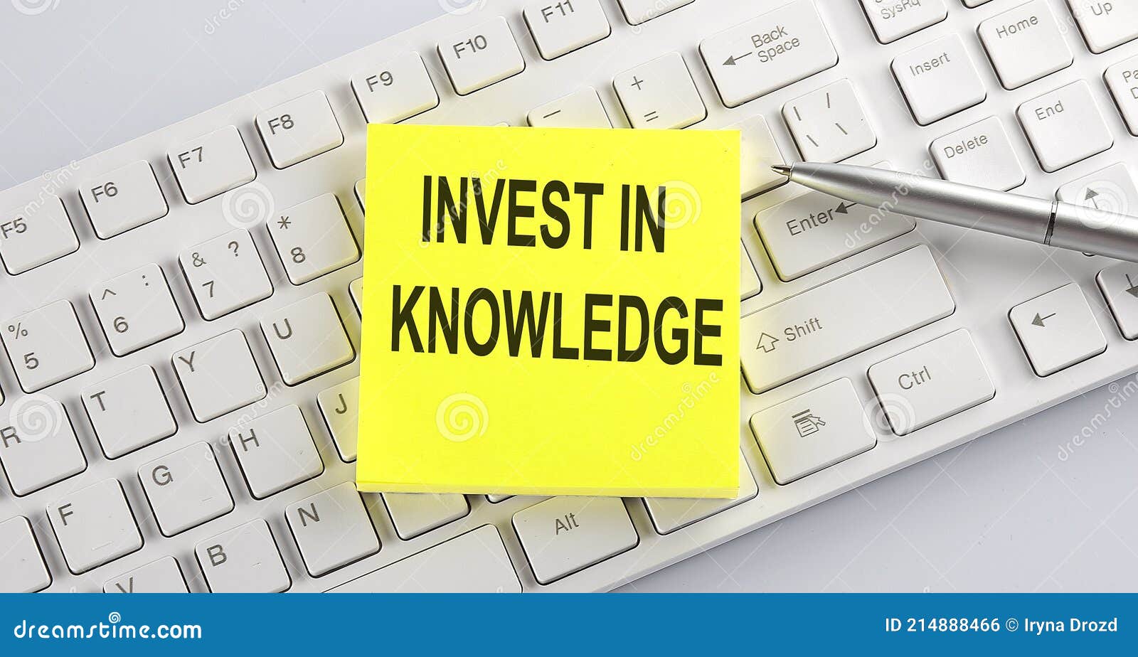 Words INVEST in KNOWLEDGE Written on Stickers on a Computer Keyboard ...
