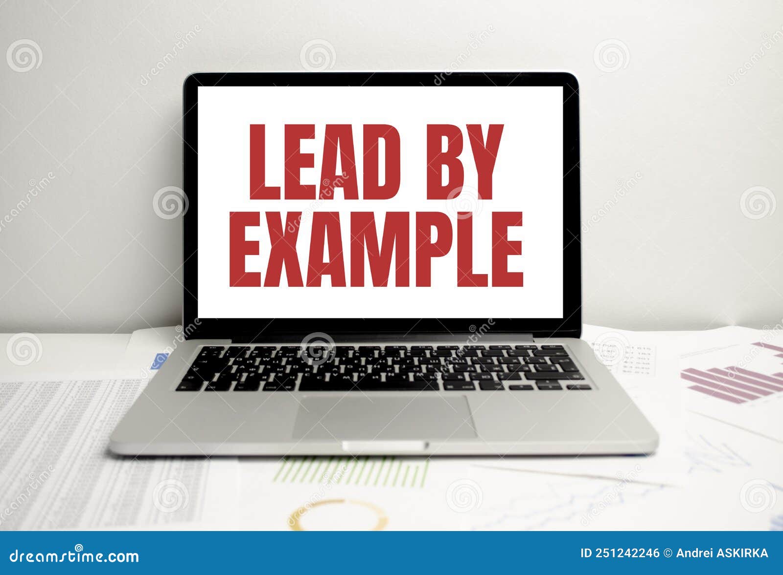 Words Lead by Example on Laptop Display and Charts Stock Photo - Image ...