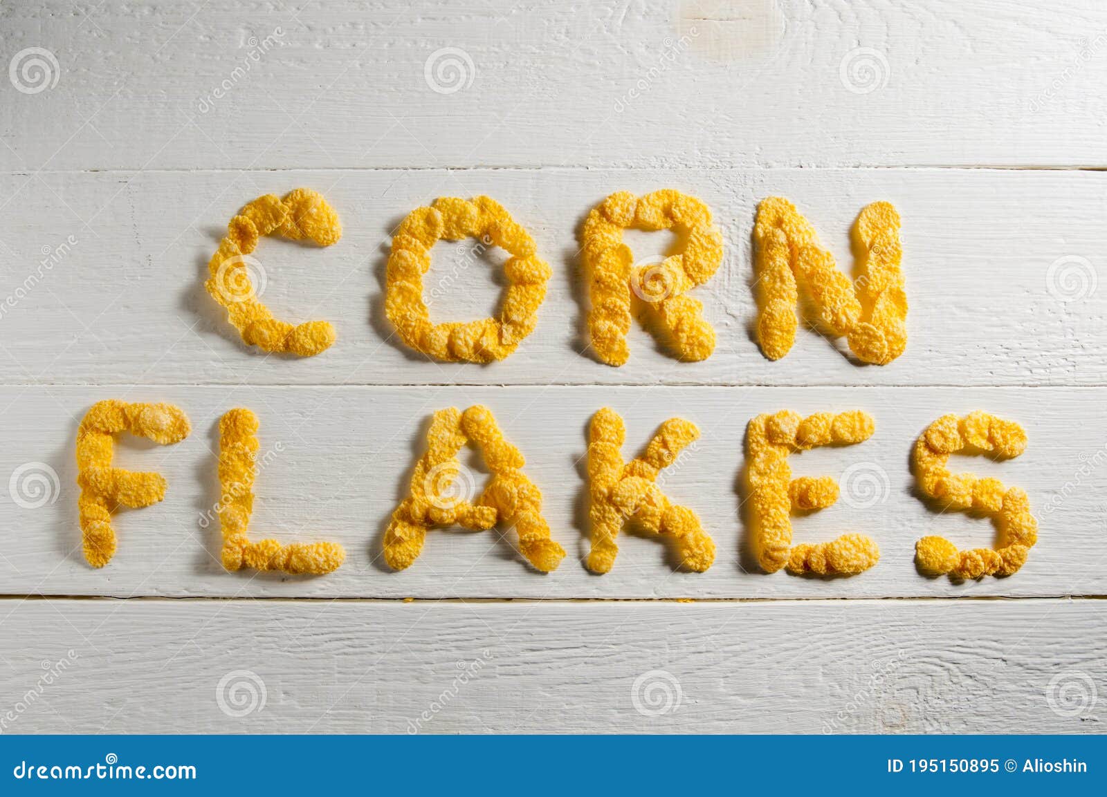 Words Made from Cornflakes Laid Out on a White Wooden Table Stock Image ...
