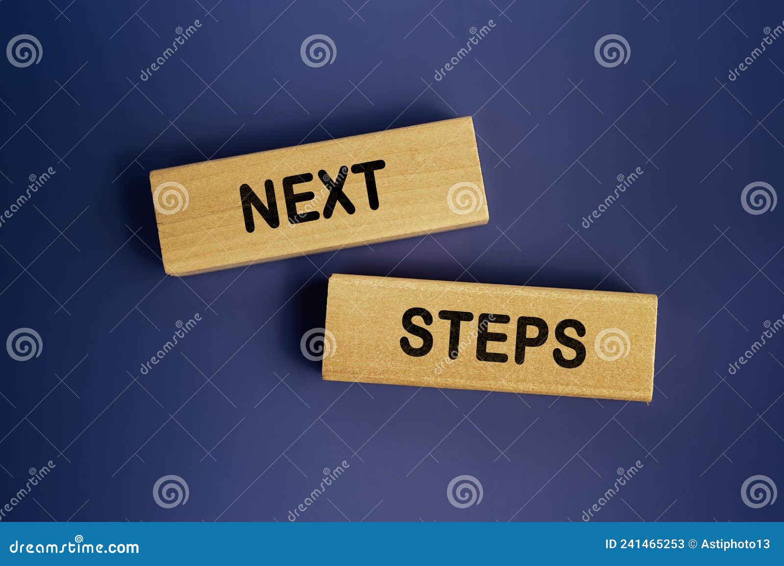 The Words NEXT STEPS is Written on a Wooden Blocks on a Beautiful Dark ...