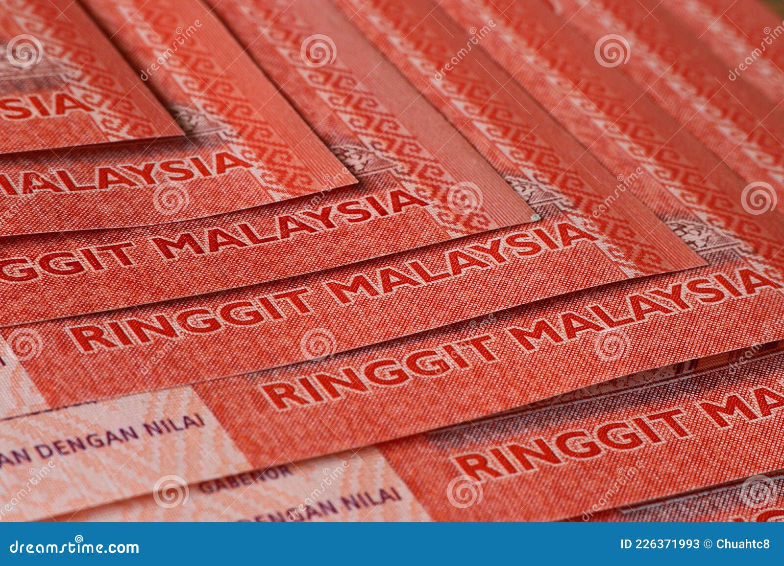 Words RINGGIT MALAYSIA on a Stack of RM10 Notes Stock Image - Image of ...