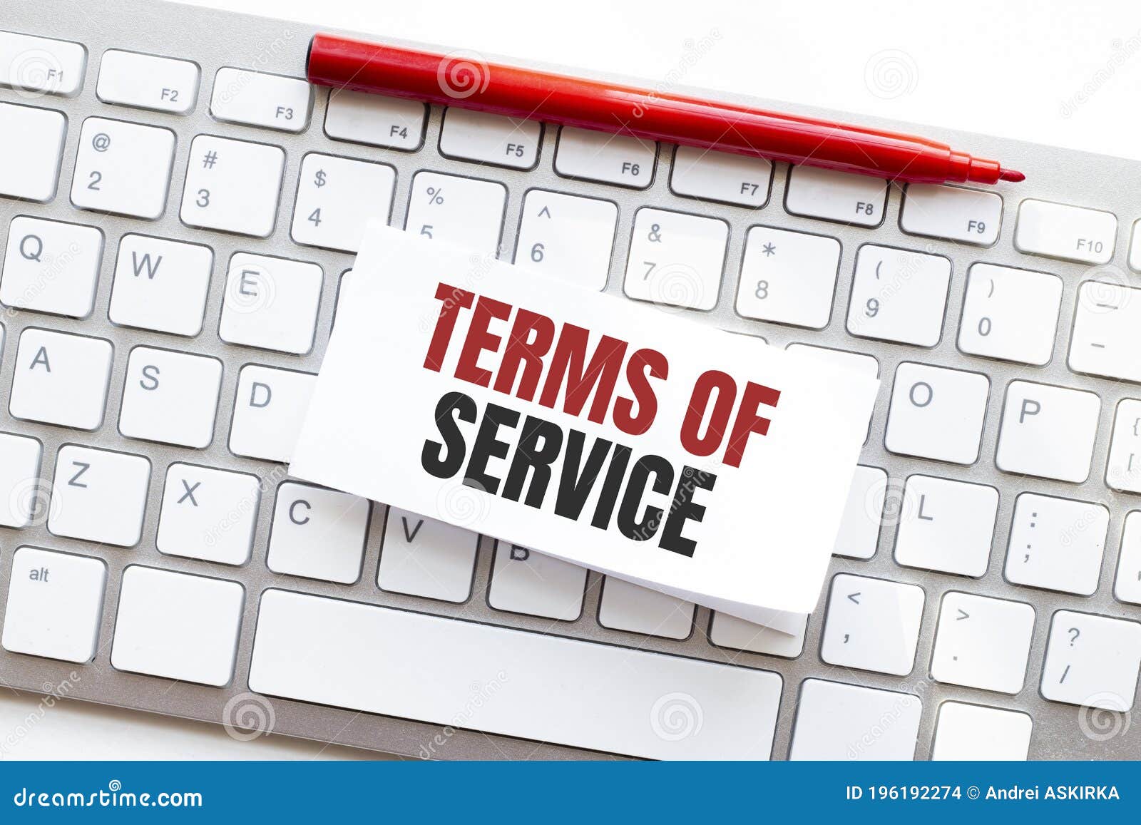 Words TERMS of SERVICE Written on Torn Paper on a Computer Keyboard ...