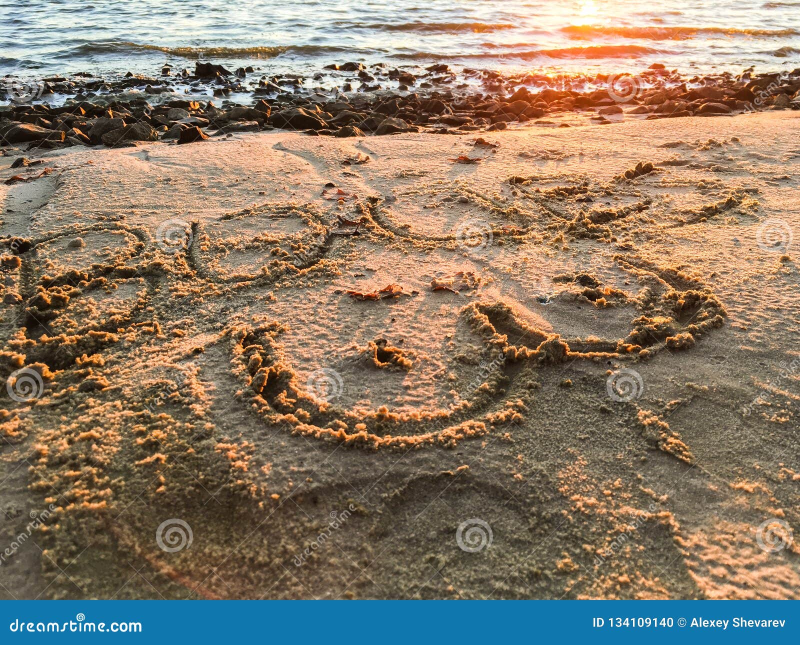 Words Written in the Sand on the Beach by a Man Stock Photo - Image of ...