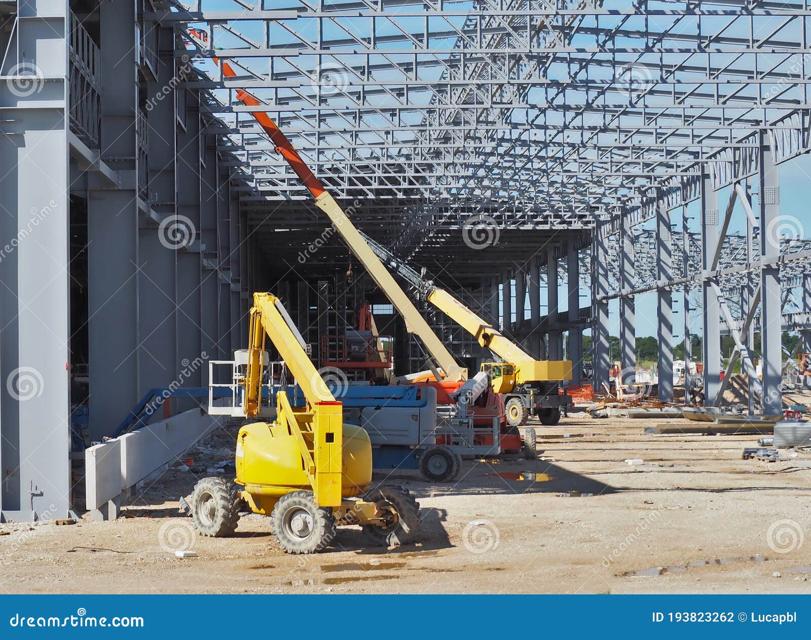 Work Aerial Platforms at Work Under a Large Frame for a New Building ...