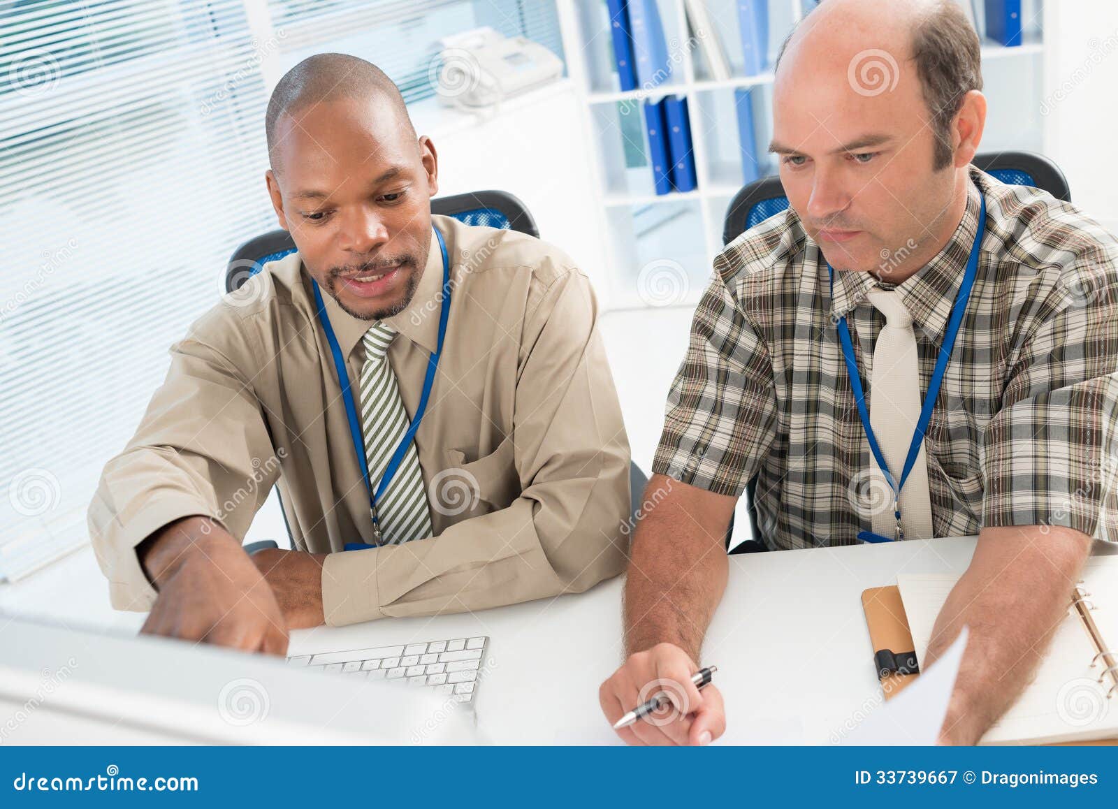 At work stock image. Image of colleagues, angle, concentration - 33739667