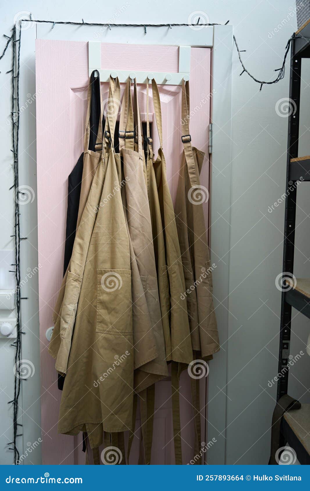 Work Aprons Hang on a Hanger in the Workshop Stock Photo - Image of ...