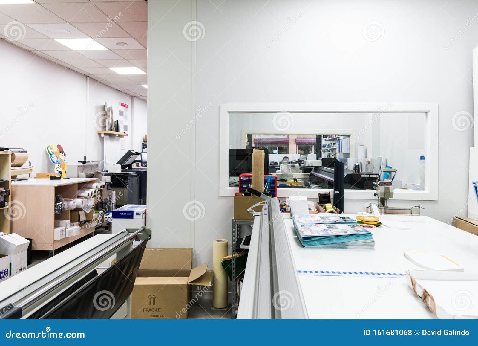 Work Area in Paper Cutting Workshop with Material and Machines Stock ...