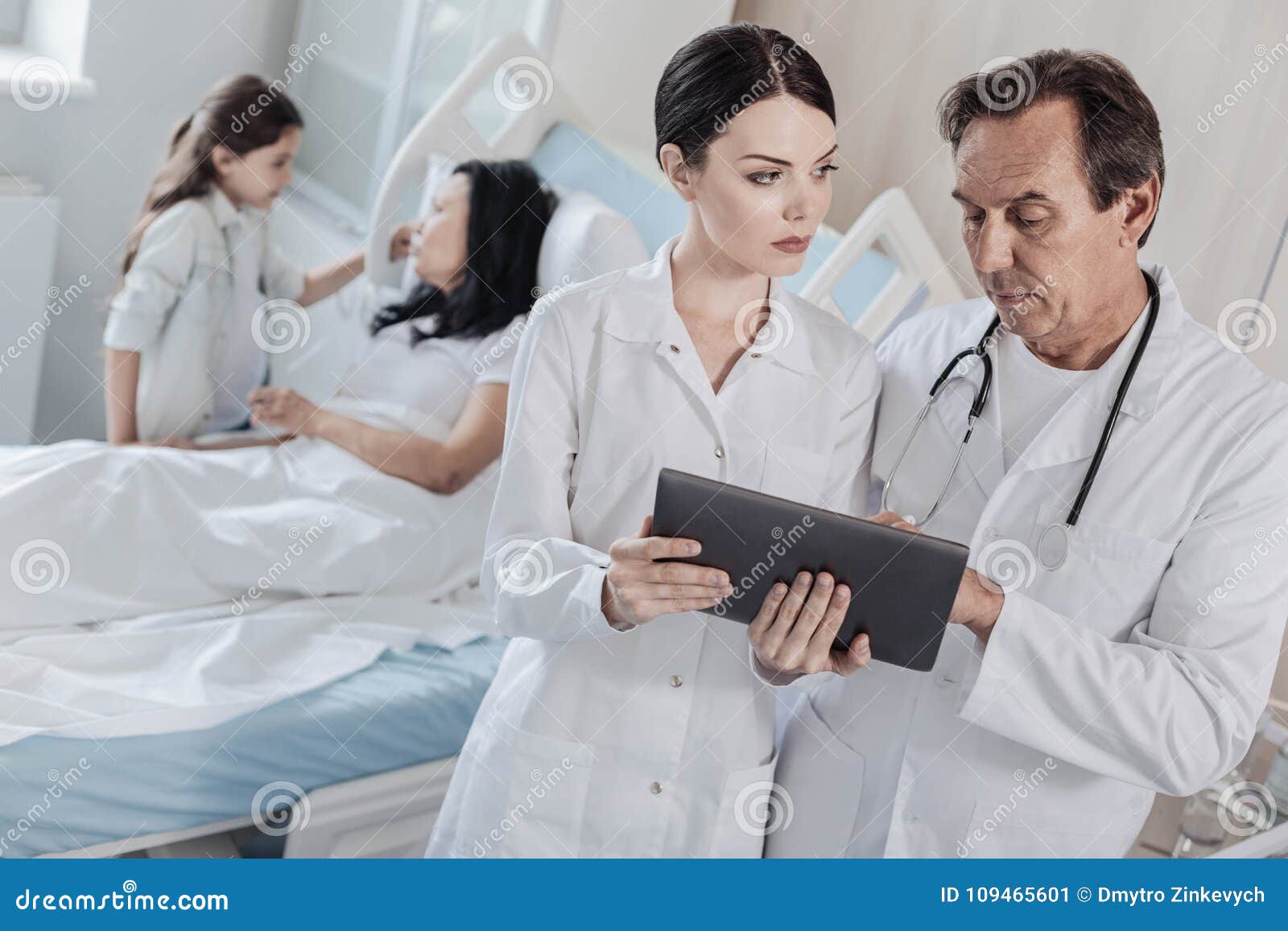 Serious Medical Worker Consulting Over Female Patient Stock Image ...