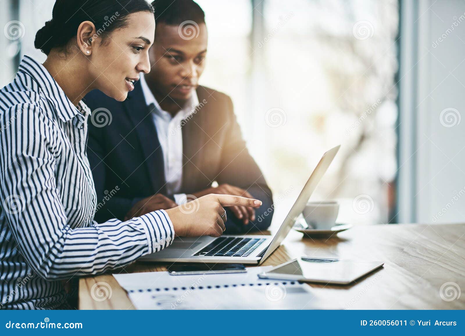 They Work Best when they Work Together. Two Businesspeople Working ...