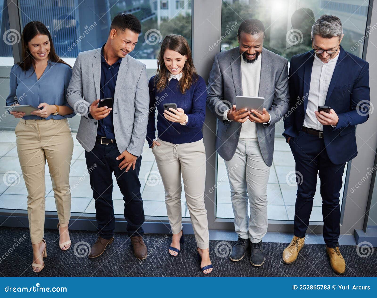 We always Work Better Together. a Group of Young Businesspeople Using ...