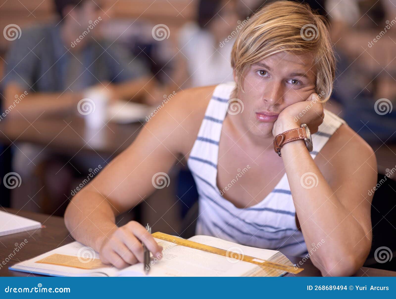 This Work is so Boring....a Bored Young Student Looking at the Camera ...