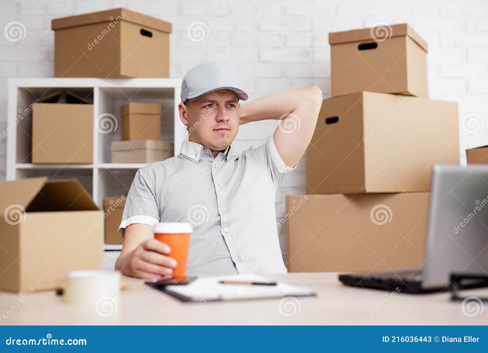 Work and Business Concept - Tired Postman Resting in Workplace with ...