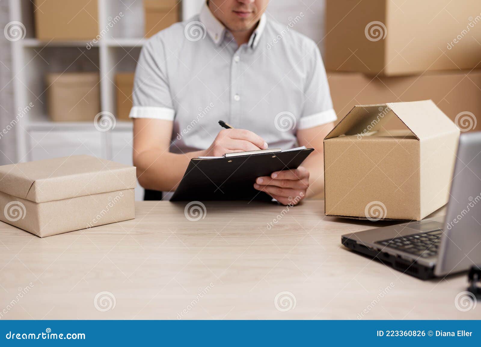 Work, Business and Delivery Concept - Close Up of Postman Hands Writing ...