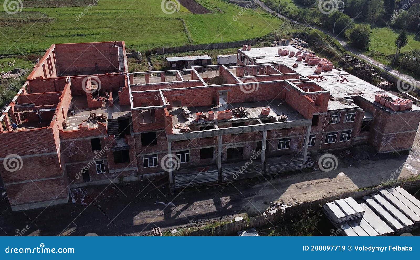 Work on a Construction Site, Building a House. Equipment and Workers ...