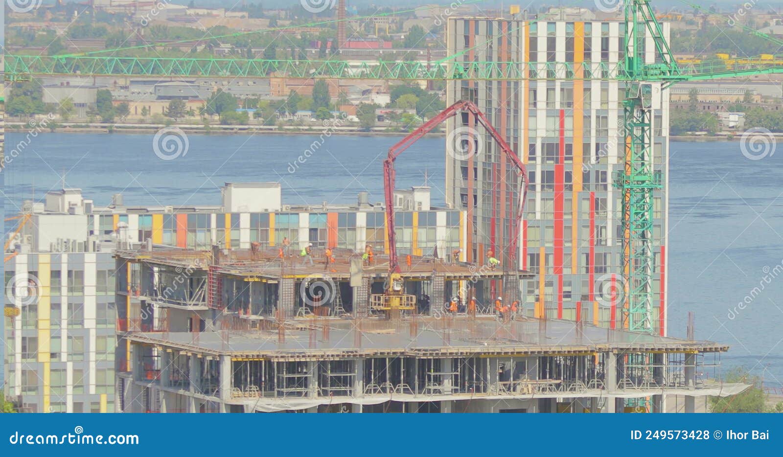 Work at the Construction Site of a Multi-storey Building. Workers Build ...