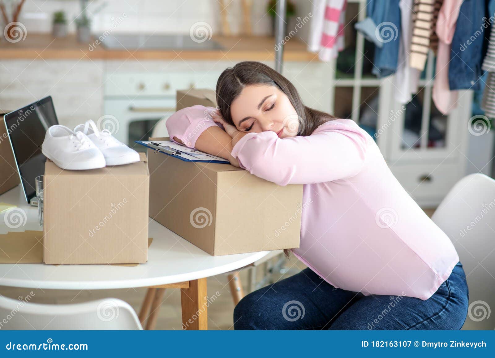 Dark-haired Young Woman Sleeping on the Boxes Stock Image - Image of ...