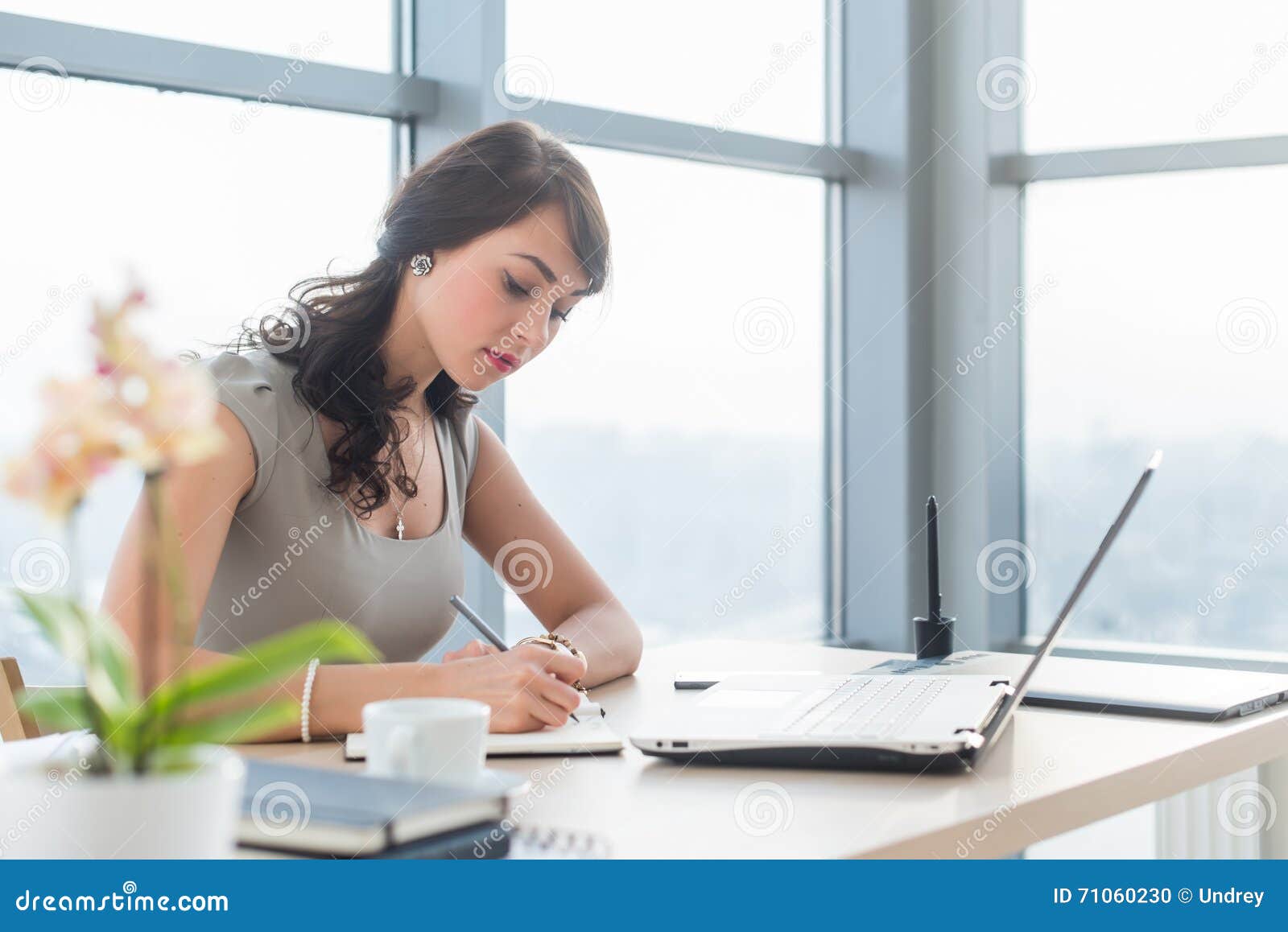 Work Day of Busy Office Manager, Writing Business Plan in Her Notebook ...