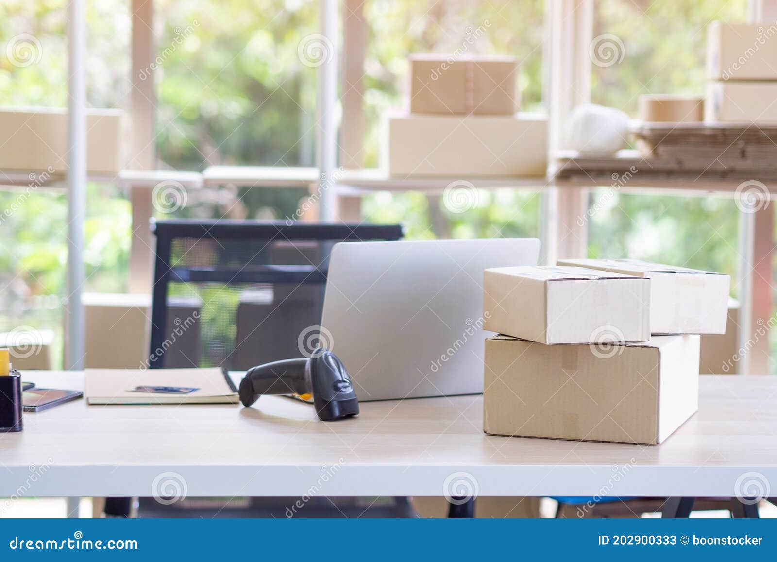 Work Desk in the Office Has a Laptop, Packaging Box and Barcode Reader ...