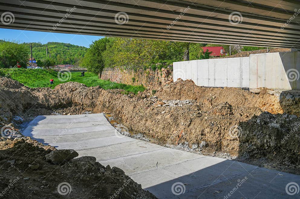 Work on the Development of a Stream Bed Against Erosion and Flooding ...