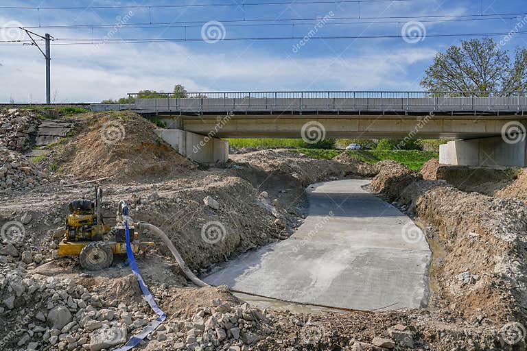 Work on the Development of a Stream Bed Against Erosion and Flooding ...