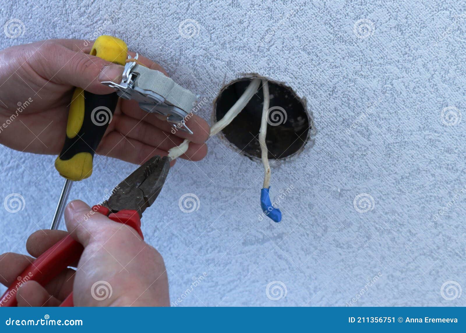 The Process Of Replacing A Damaged LED Lamp With A Downlight. A Man In ...