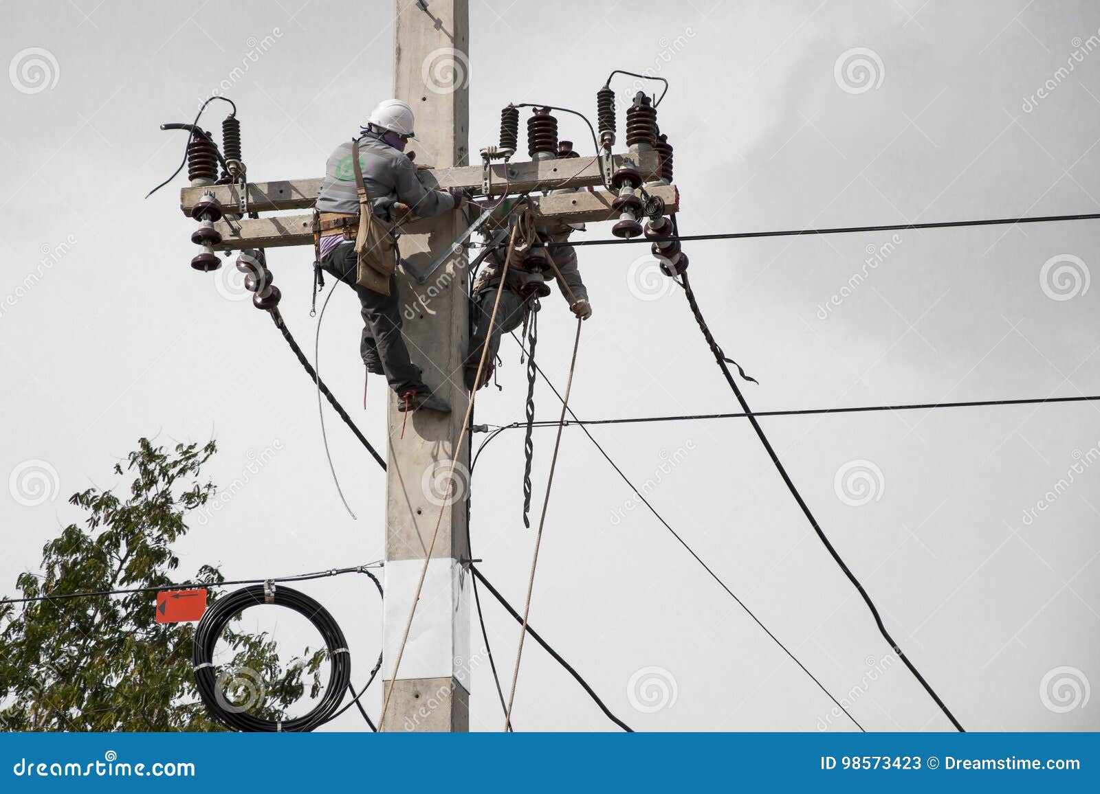 Work on electricity poles editorial stock photo. Image of people - 98573423